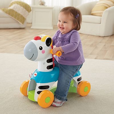 Fisher price zebra ride on store